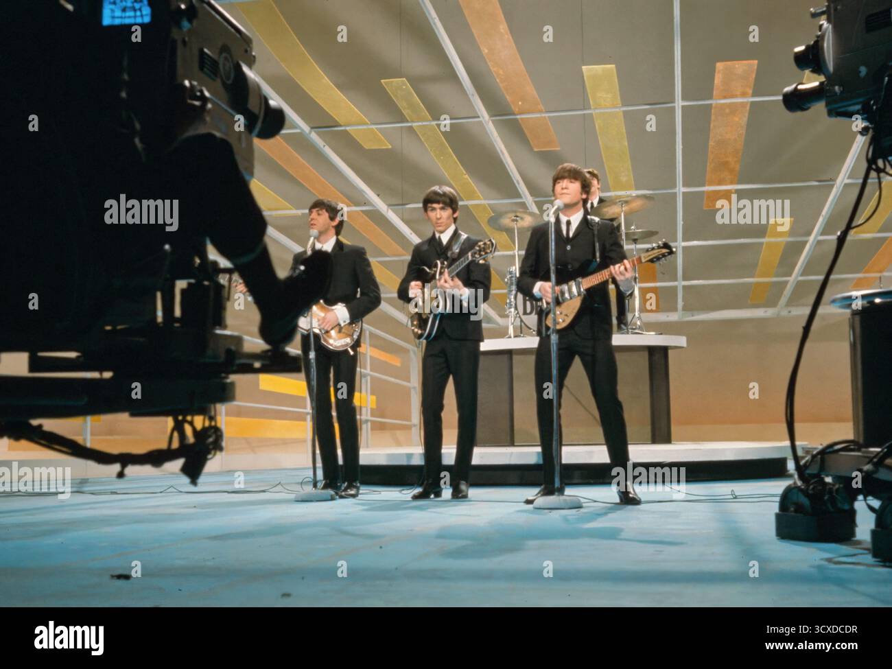 The Beatles performing on stage on the Ed Sullivan show in 1964 in New ...