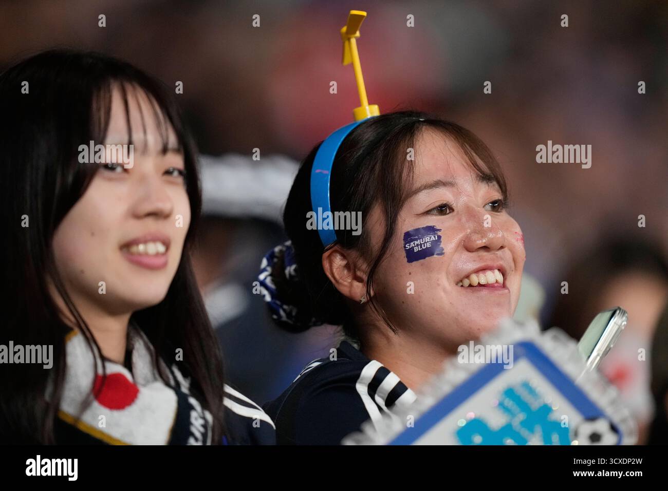 Japanese fans cheer during the friendly soccer match between Japan and ...