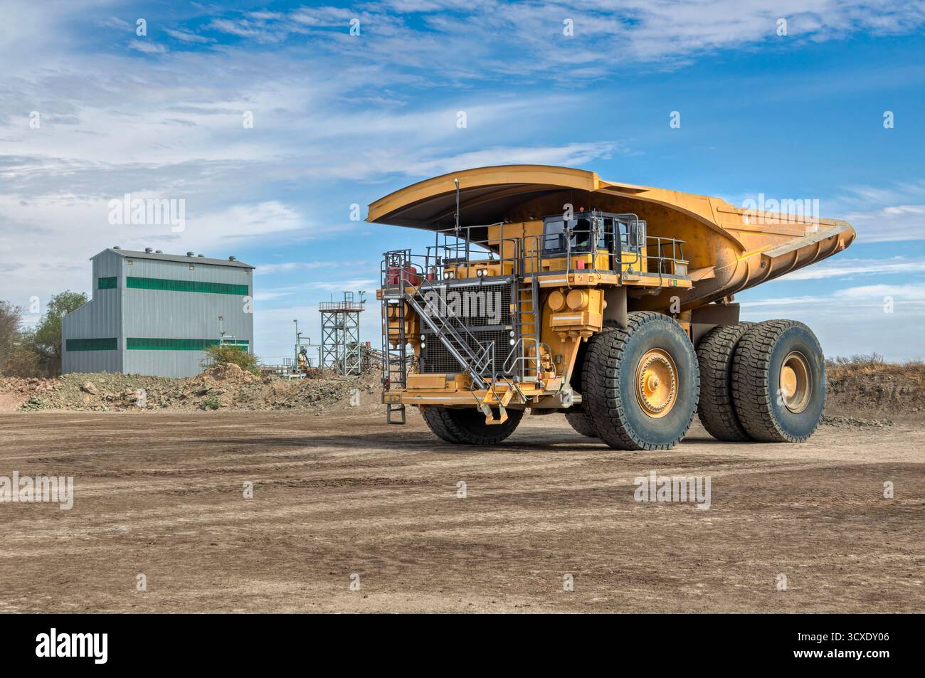 aerial view of mining truck driving on dirt road, in a diamond mine ...
