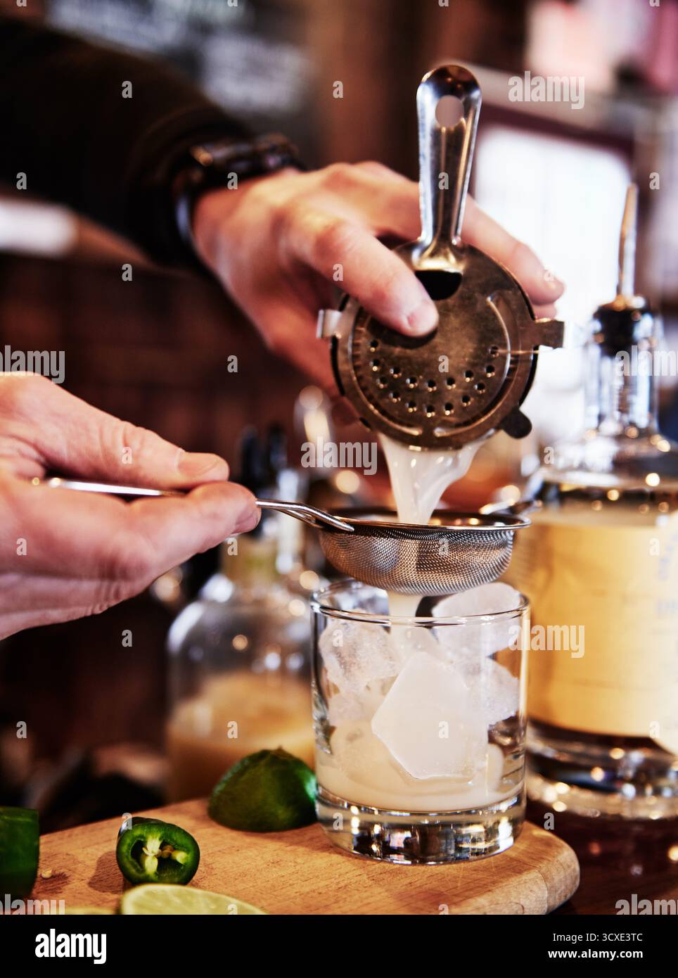 Margarita cocktail being poured glass hi-res stock photography and ...