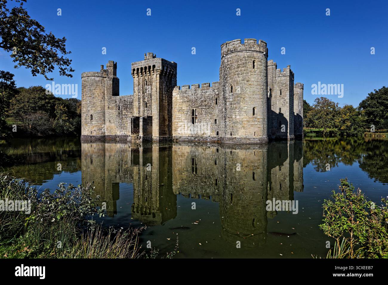 English Castle with a moat Stock Photo - Alamy