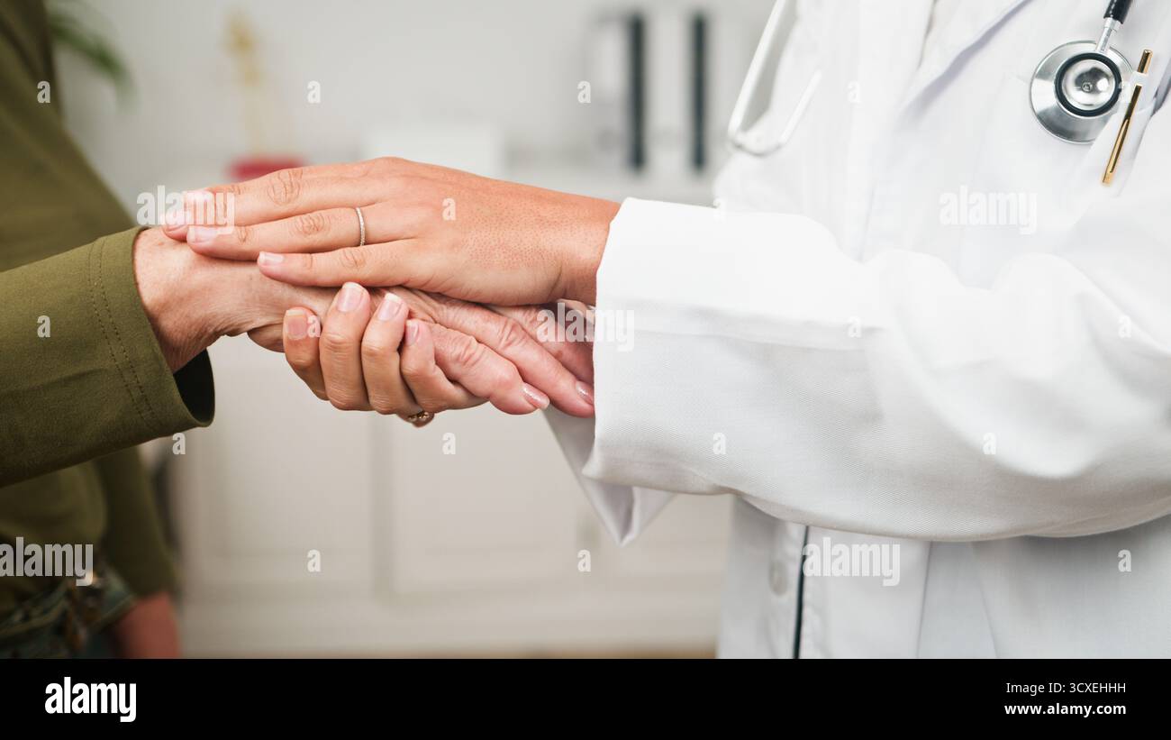 Compassionate Doctor Offers Gentle Support To Patient With Shared Hands ...