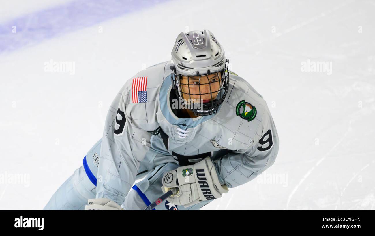 Air Force left wing Anthony Yu (9) skates the puck during an NCAA ...