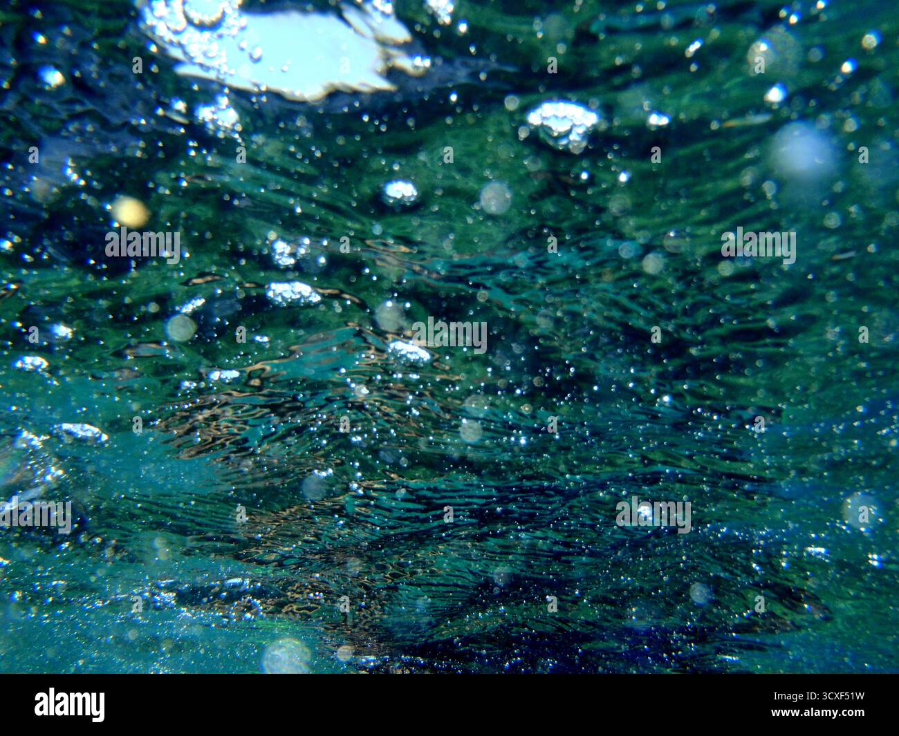 bubbles and small foam on the surface of sea water as seen from ...