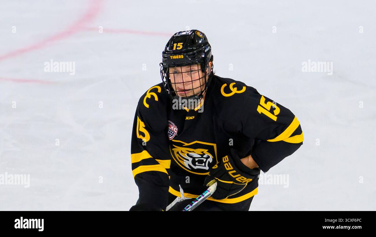 Colorado College defender Nick Baer (15) skates the puck during an NCAA ...