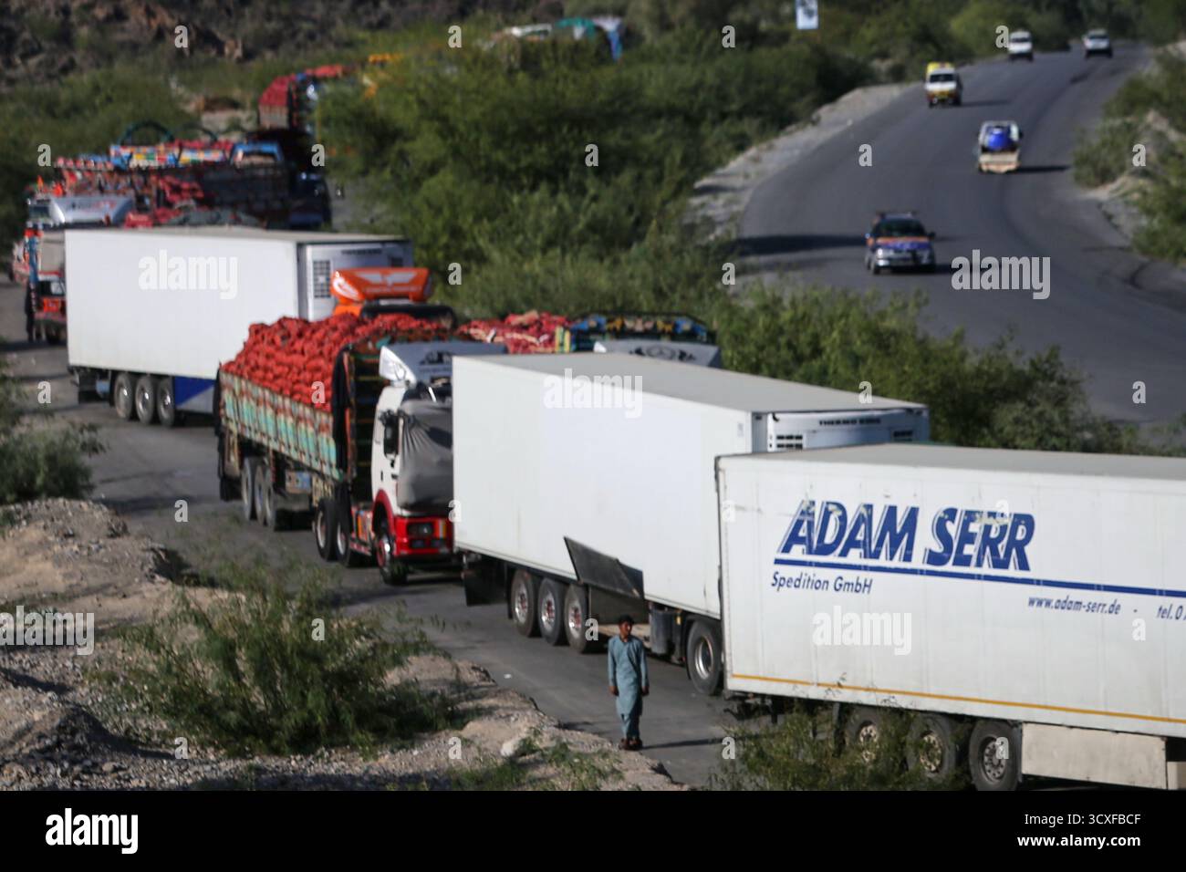 A line of cargo trucks bound for Pakistan is stranded on the Afghan ...