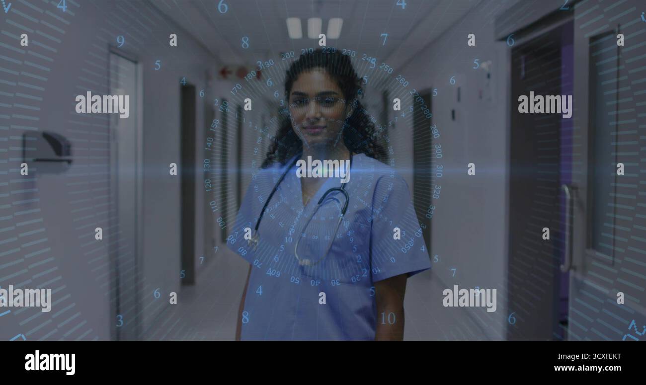 Standing nurse wearing scrubs with stethoscope in corridor, with ...