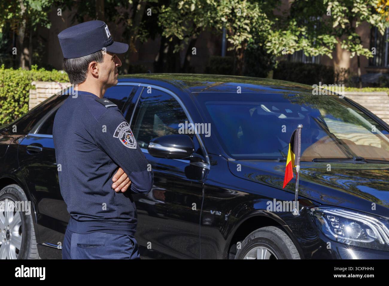 Yerevan, Armenia. 14th Oct, 2025. A police officer and a car with ...
