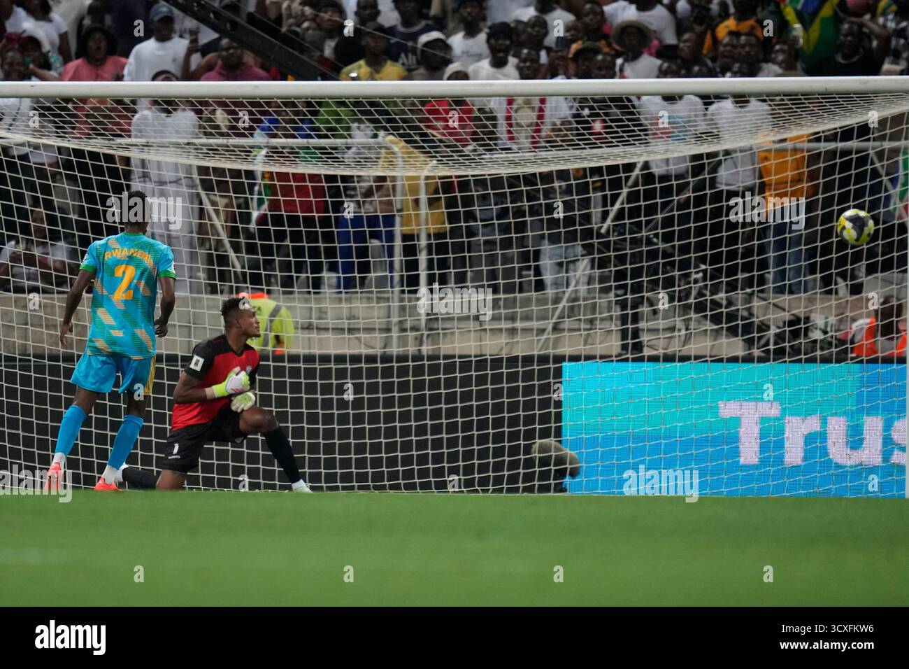 Rwanda's goalkeeper Fiacre Ntwari watches the ball as South Africa's ...