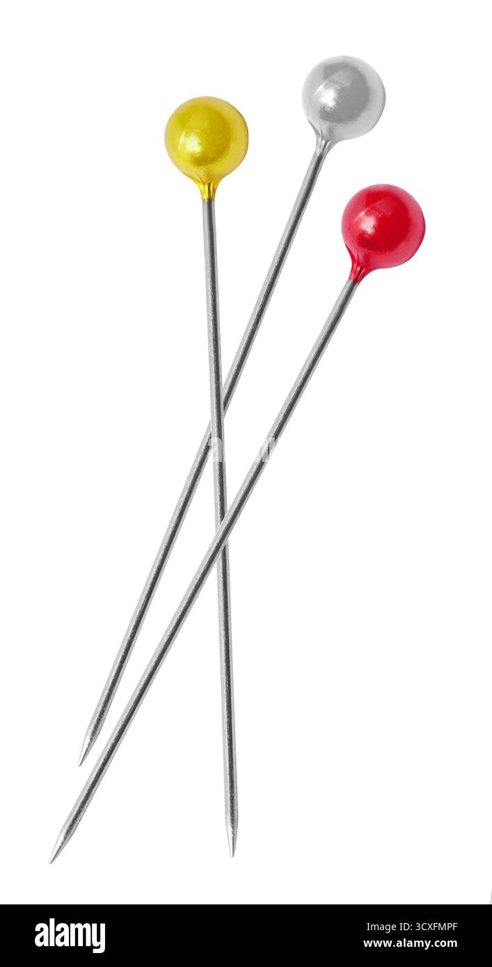 Sewing pins with red, gold, and silver heads lying on a transparent ...
