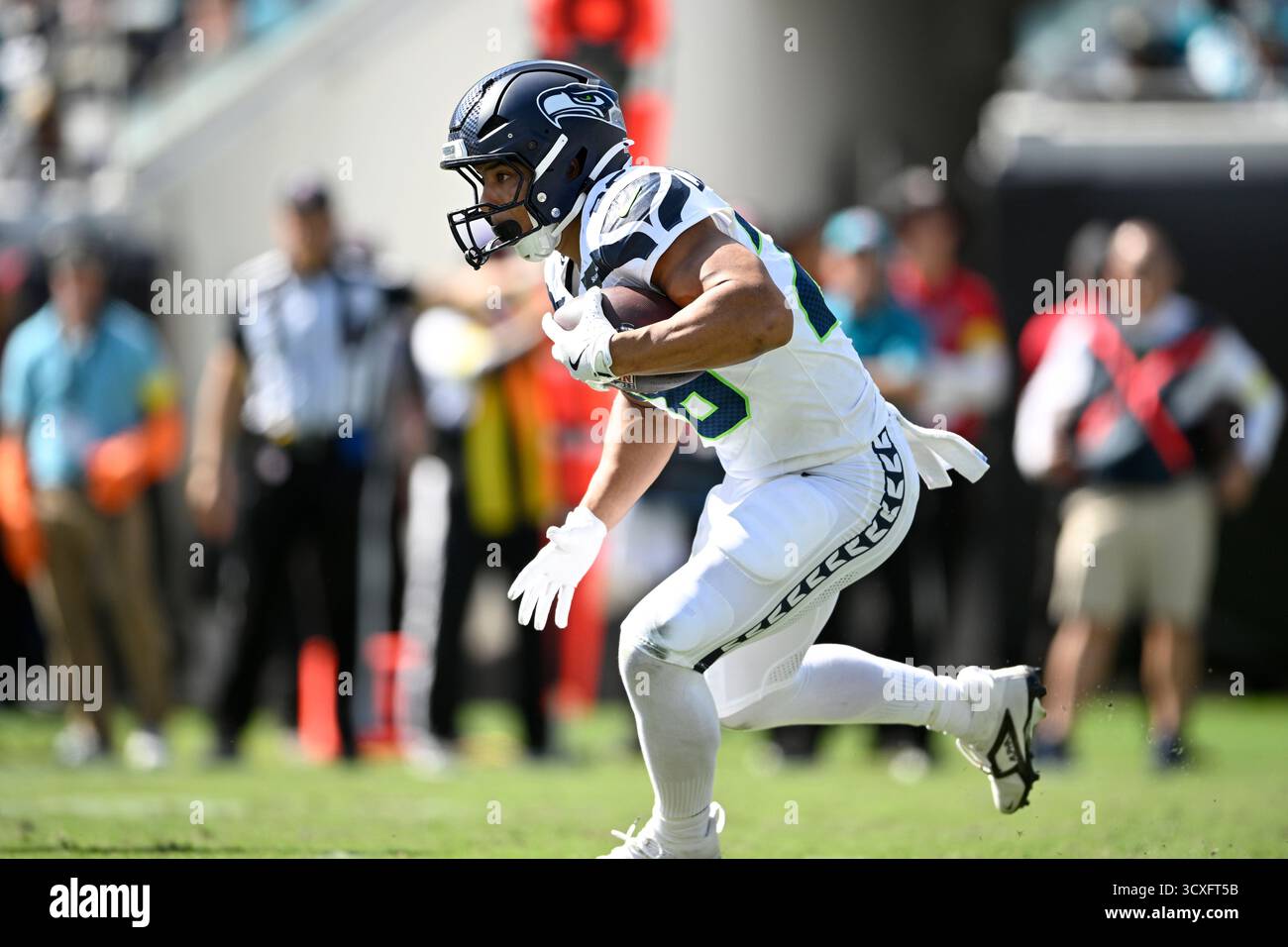Seattle Seahawks running back Zach Charbonnet (26) rushes for yardage ...