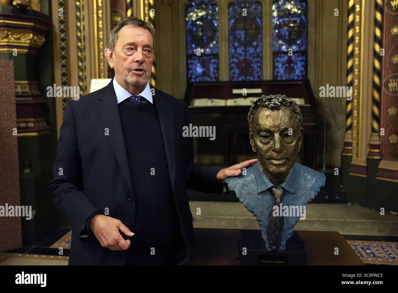 Lord David Blunkett with a bronze bust of himself at the House of Lords ...