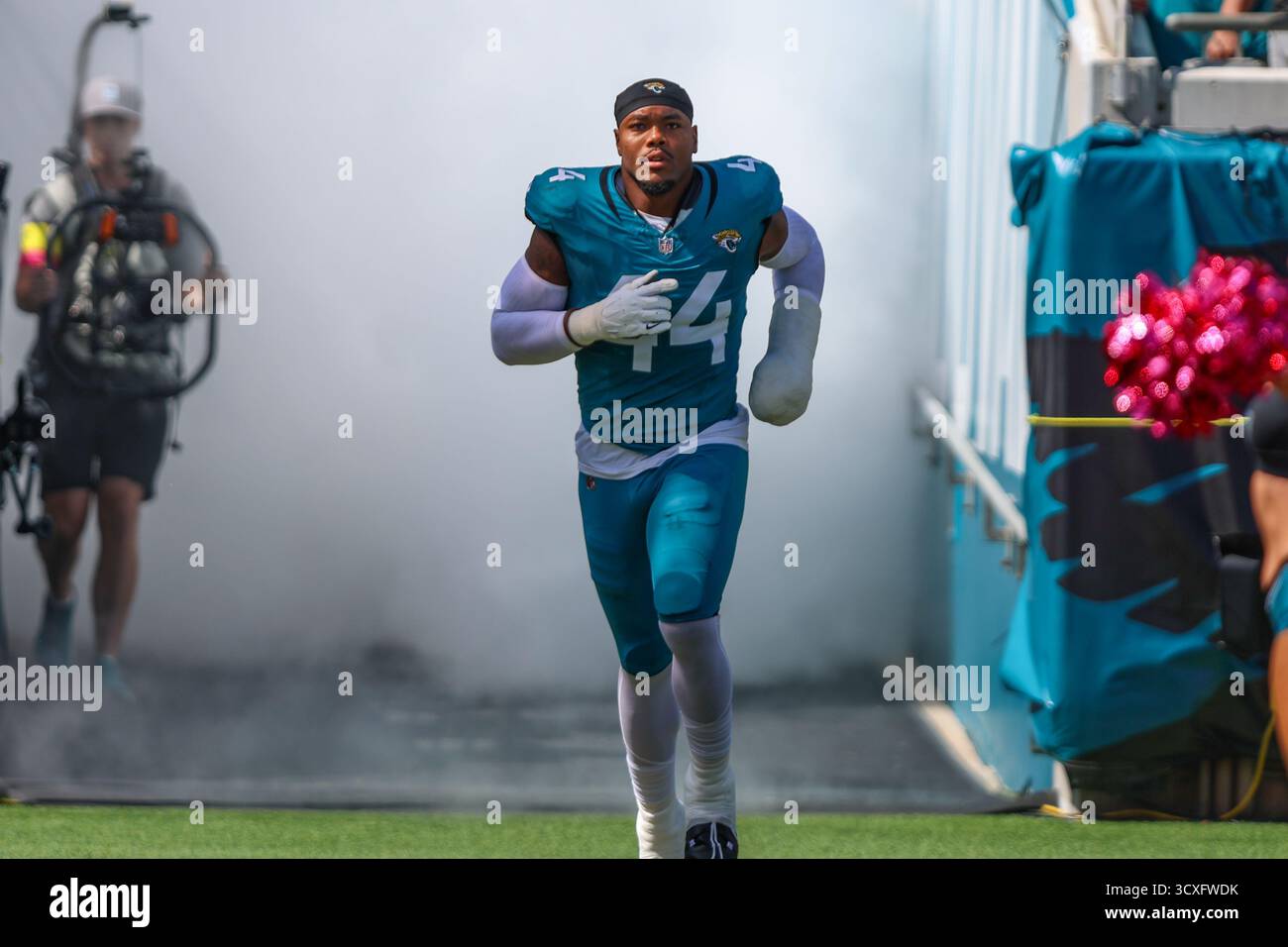 Jacksonville Jaguars defensive end Travon Walker (44) runs onto the ...