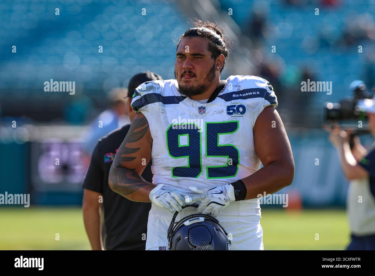 Seattle Seahawks defensive tackle Brandon Pili (95) walks off the field ...