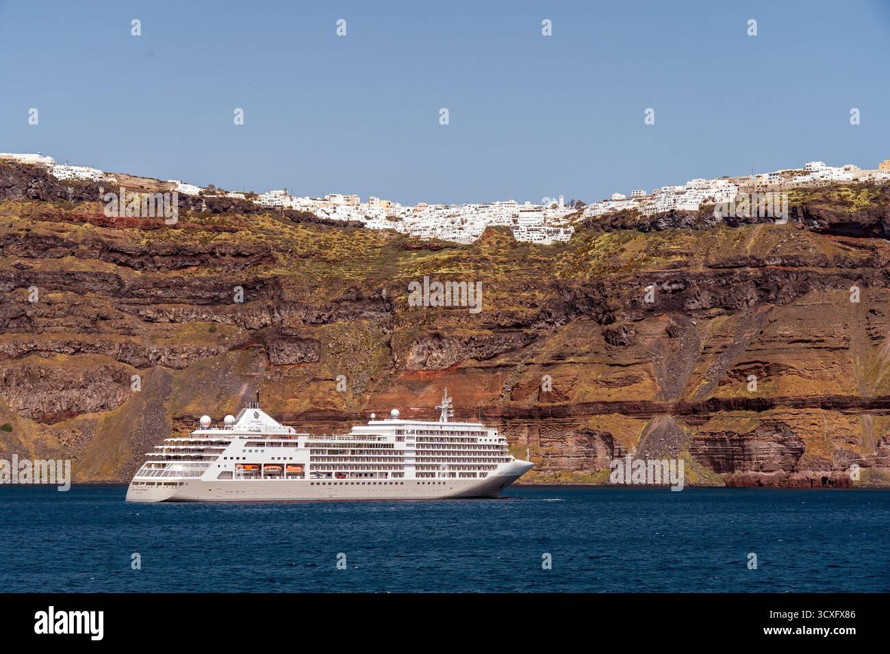 Panoramic view of Fira town in Santorini, Greece, seen from the sea ...