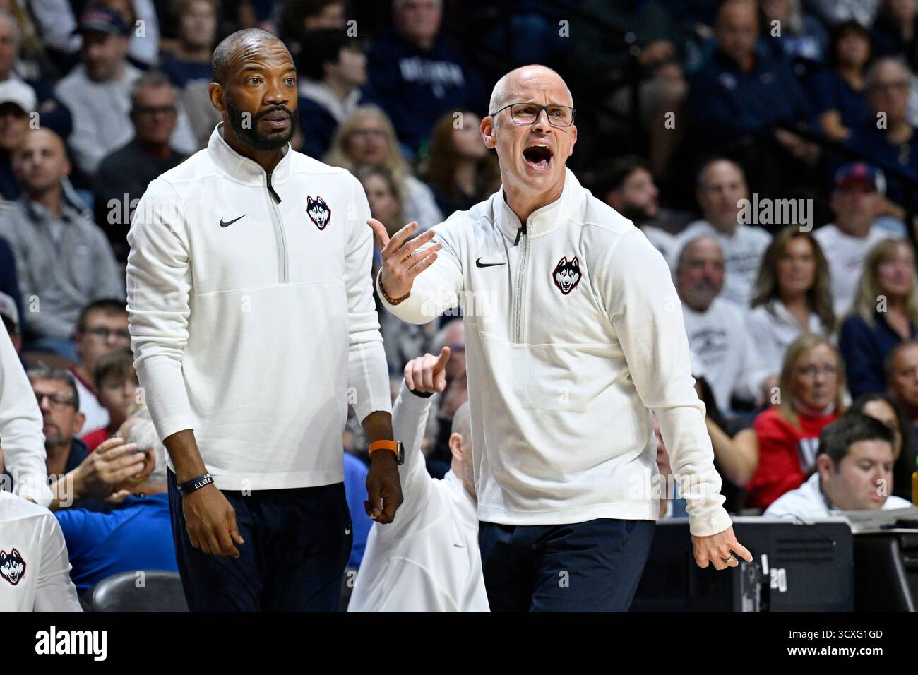 UConn head coach Dan Hurley calls out to his team as associate head ...