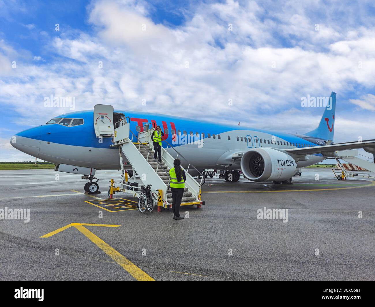 Passengers boarding a Boeing 737 MAX 8 airplane, aeroplane or aircraft ...
