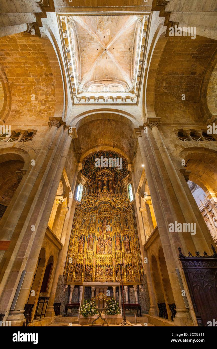 A grand, sunlit church interior features soaring stone columns and a ...