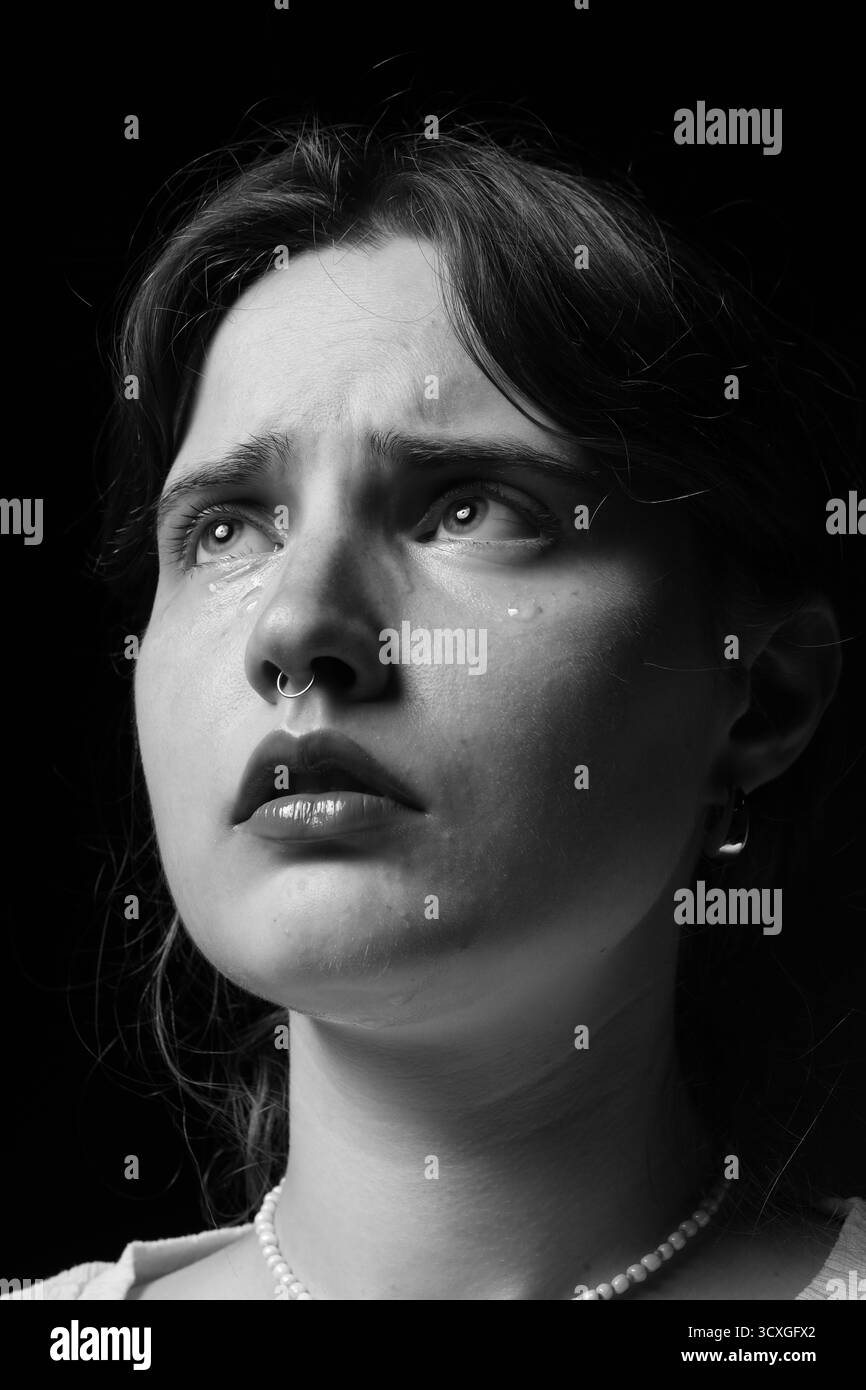 Sad woman crying on dark background. Black and white effect Stock Photo ...