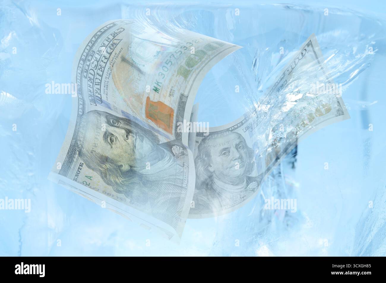 Dollar bills in ice hi-res stock photography and images - Alamy