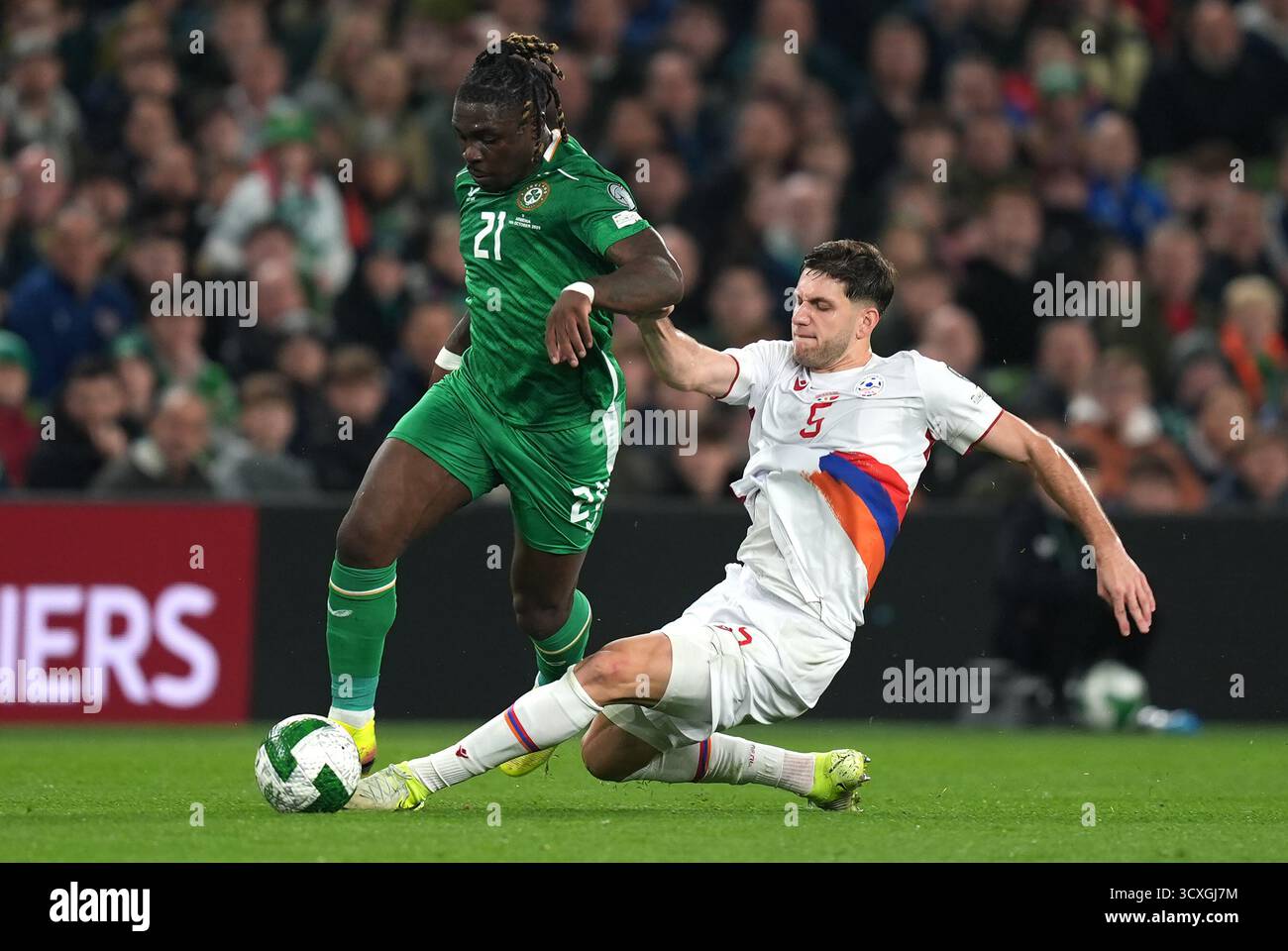 Republic of Ireland's Festy Ebosele (left) and Armenia's Styopa ...