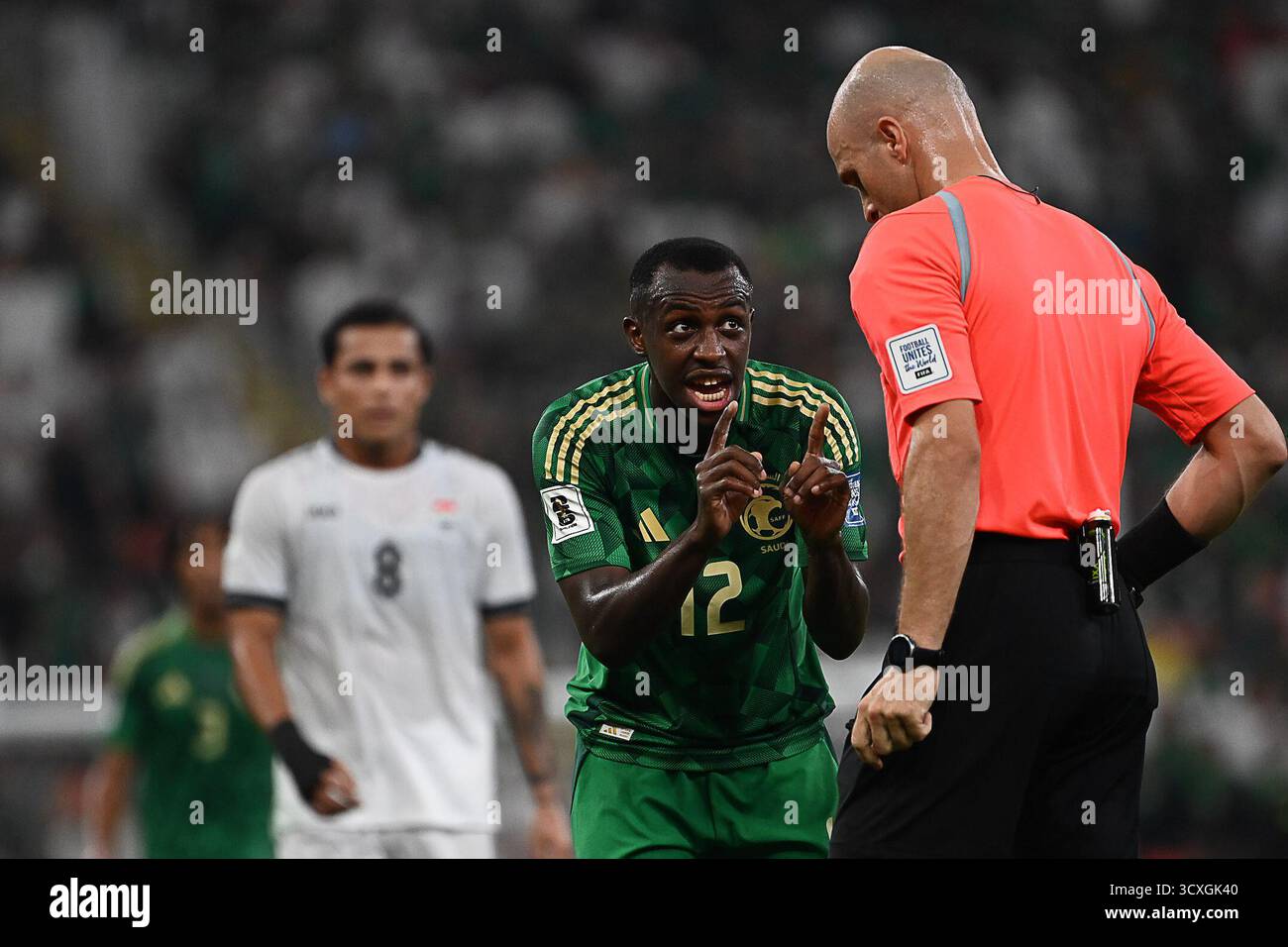 Saudi Arabia's Saud Abdulhamid, left, argues with referee Adham ...