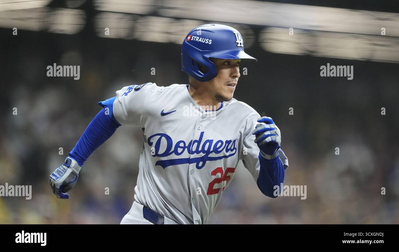 Los Angeles Dodgers second baseman Tommy Edman runs to first during the ...