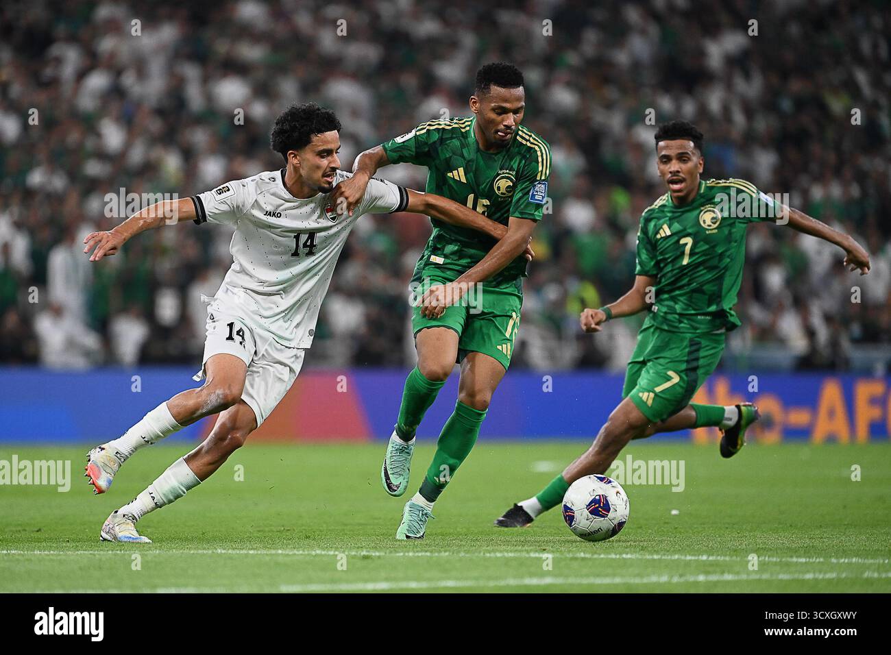Iraq's Zidane Aamar Iqbal, left, is challenged by Saudi Arabia's Aiman ...