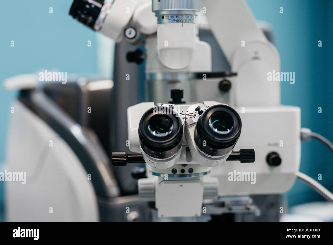 Advanced ophthalmology microscope featuring dual lenses in a clinical ...