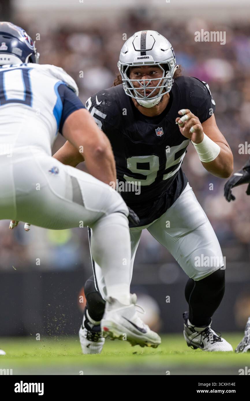 Las Vegas Raiders defensive lineman Leki Fotu (95) rushes against the ...