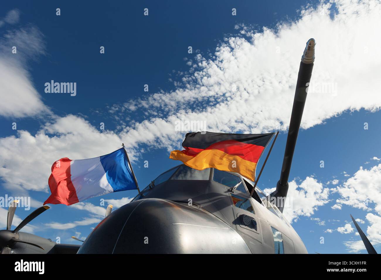 Military airplane and aircraft with two wavy national flags of Germany ...