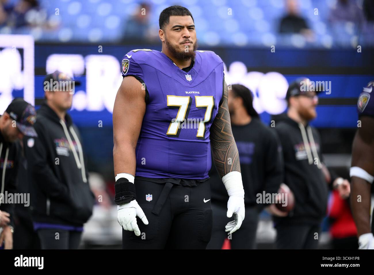 Baltimore Ravens guard Daniel Faalele (77) warms up before an NFL ...