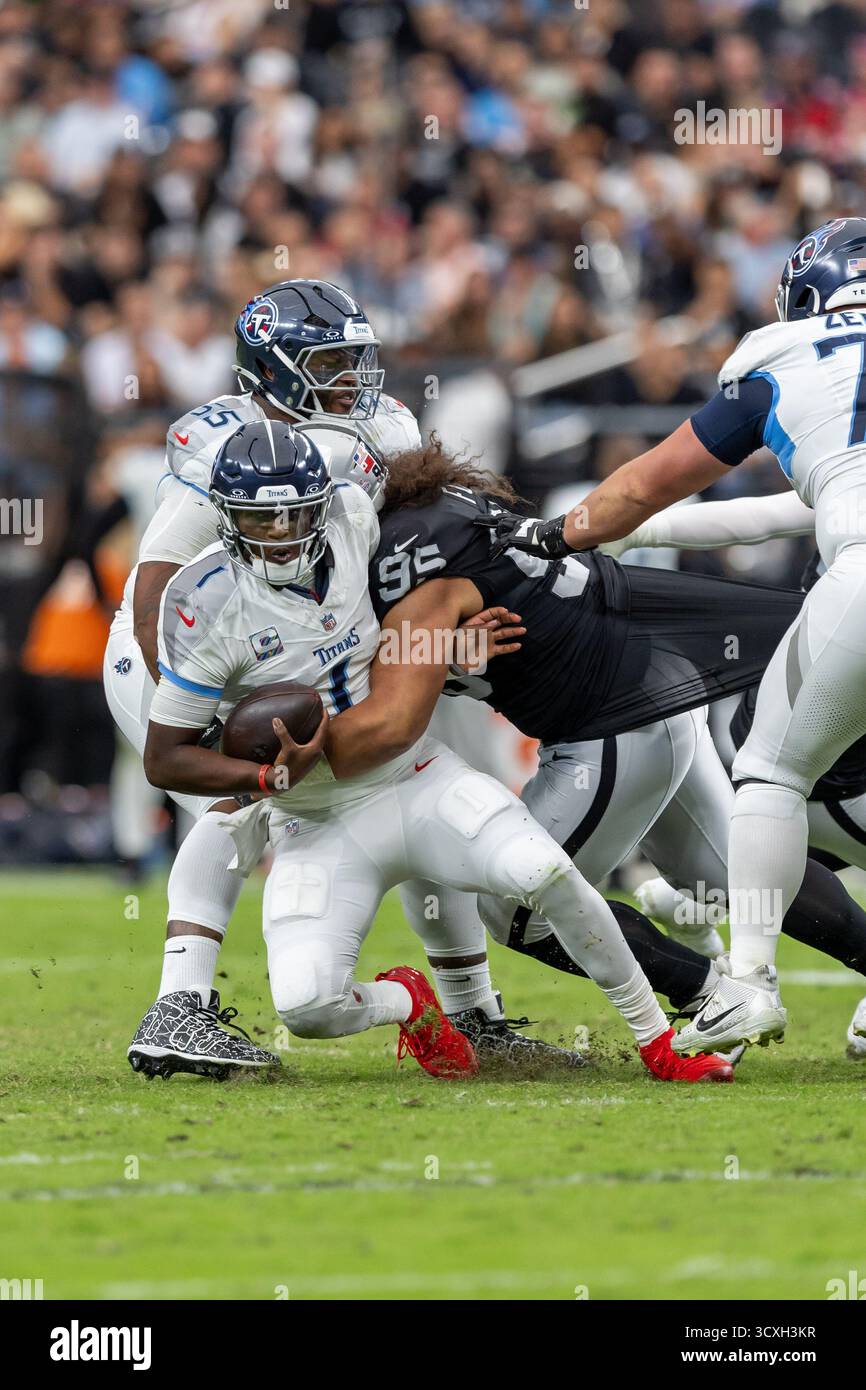 Tennessee Titans quarterback Cam Ward (1) is sacked by Las Vegas ...
