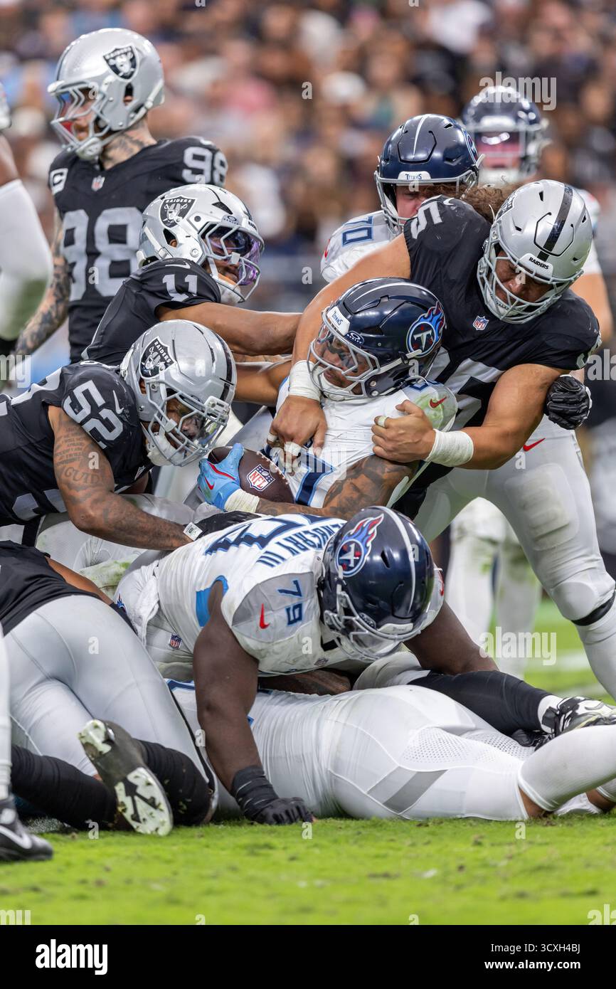 Tennessee Titans running back Tony Pollard (20) is tackled by the Las ...