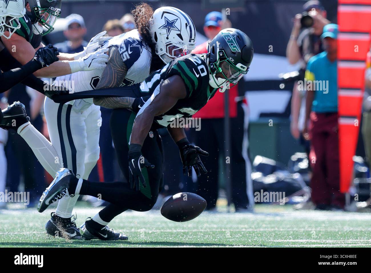 New York Jets running back Breece Hall (20) fumbles the ball in action ...
