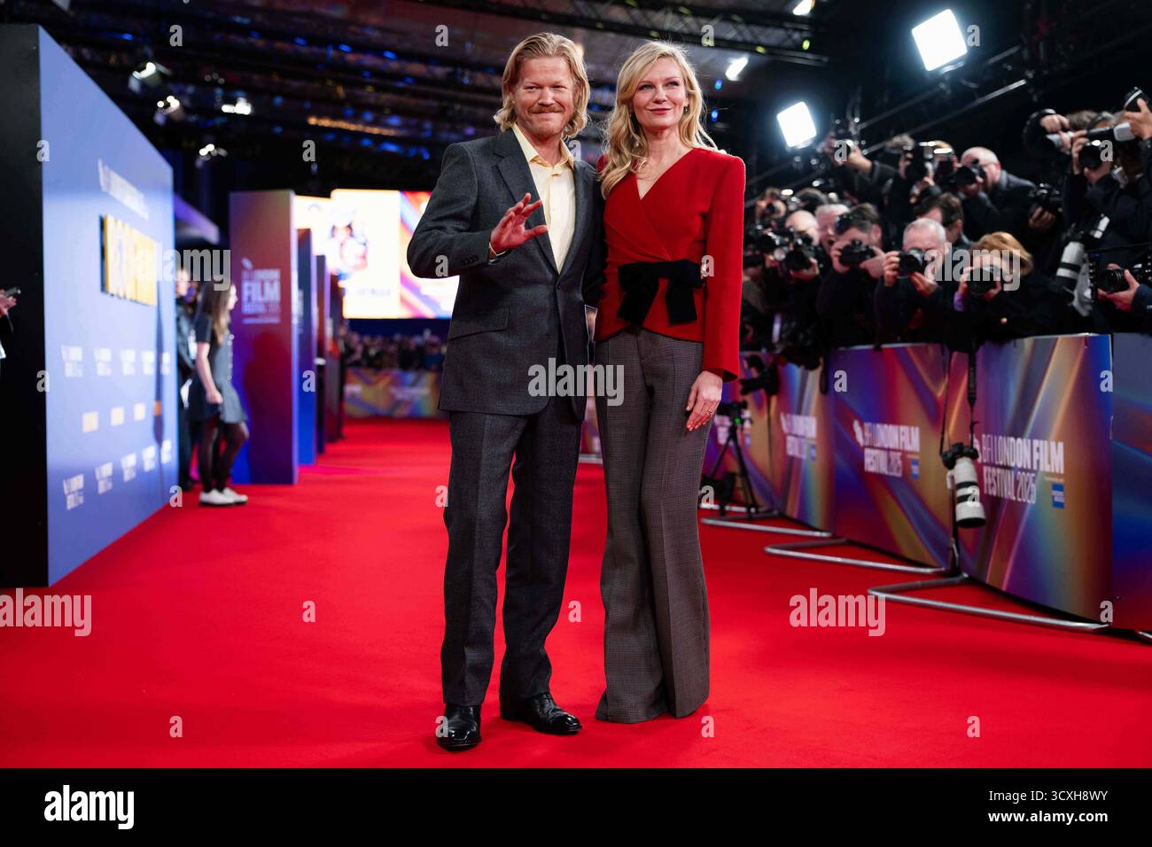 Jesse Plemons, left, and Kirsten Dunst pose for photographers upon arrival at the premiere of ...
