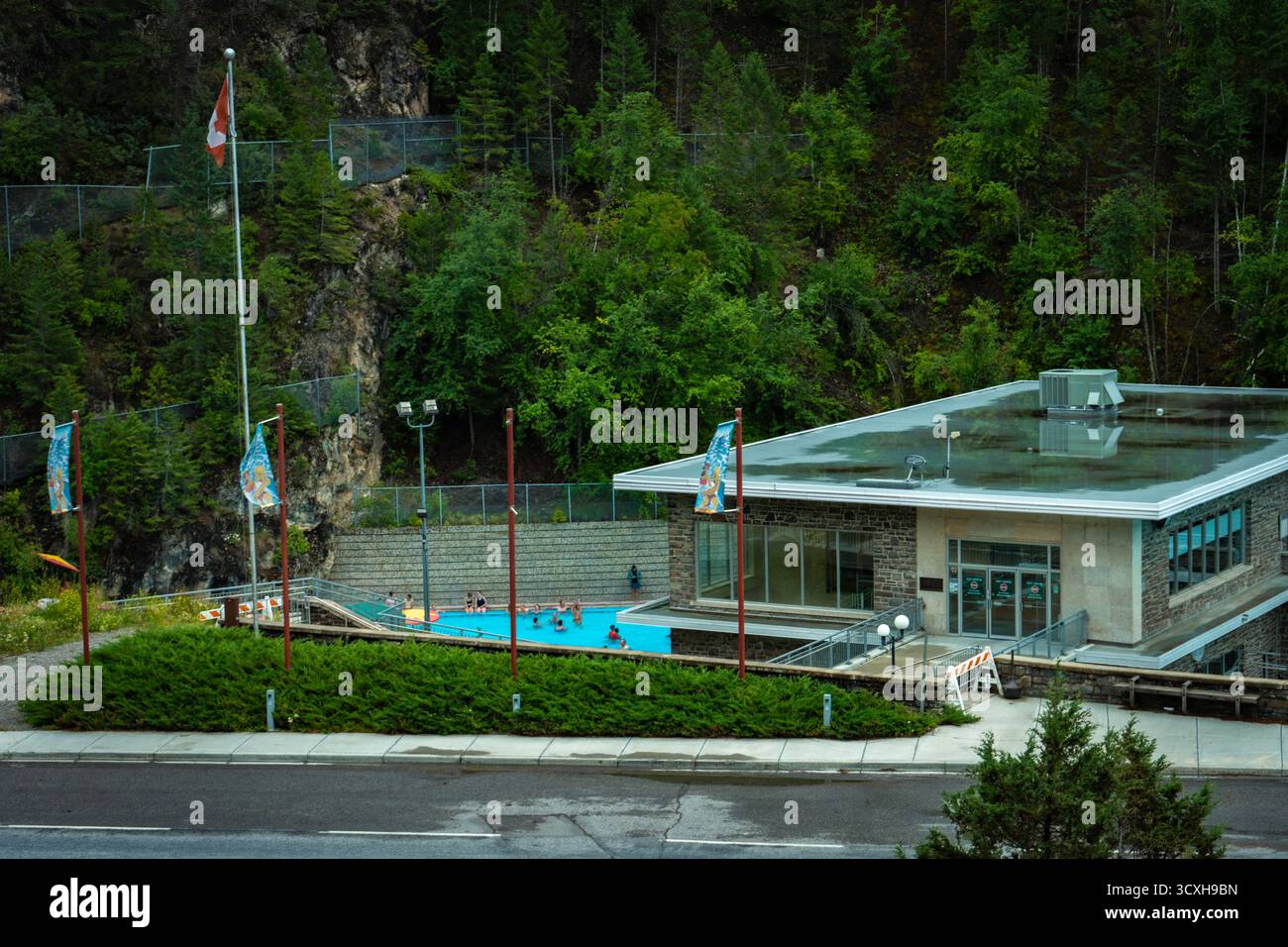 Outdoor Pool and Facility Adjacent to Rock Face and Forest Area, Canada ...