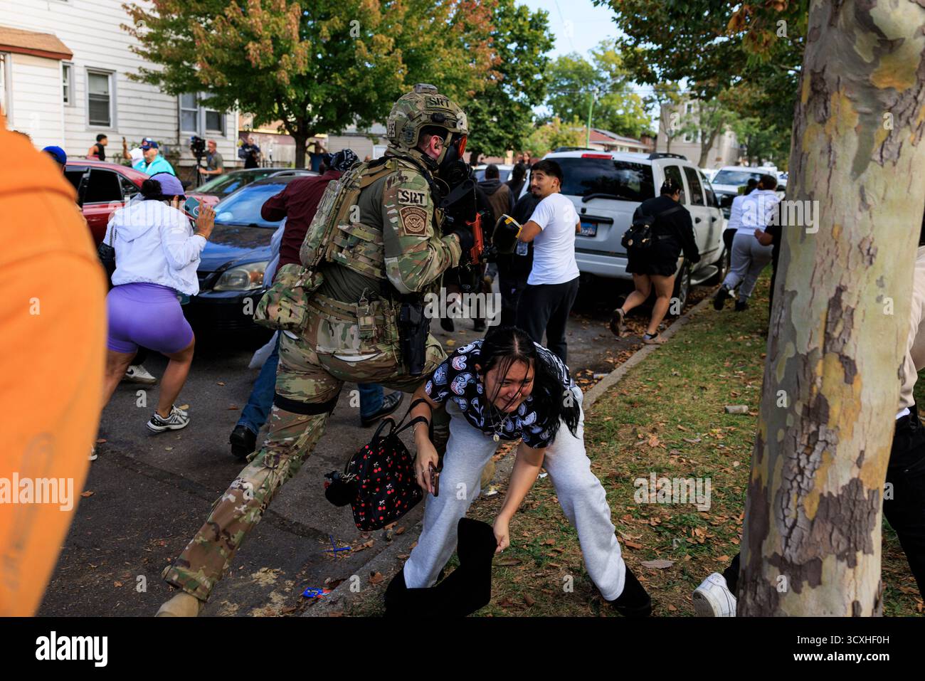 A government official clashes with protesters in Chicago Tuesday, Oct ...