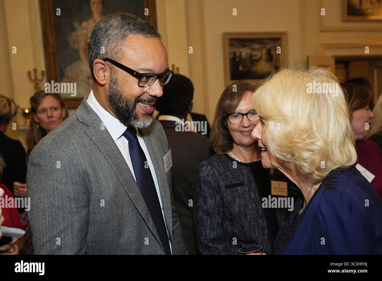 Queen Camilla, right, speaks with Ed Poultney during a reception to ...