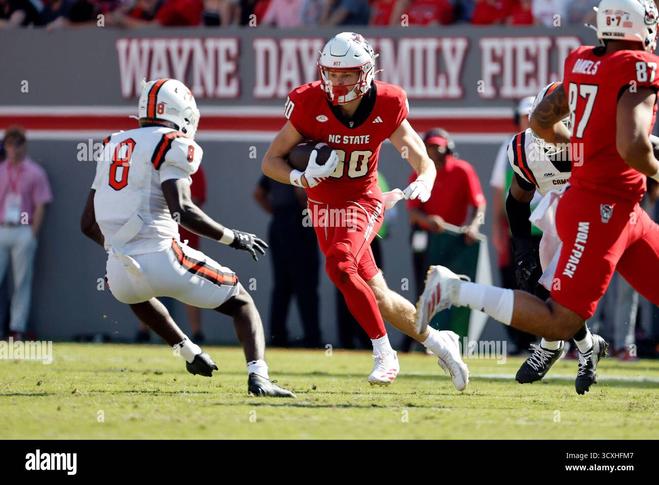 North Carolina State's Ethan Dowdy (80) advances the ball after a ...