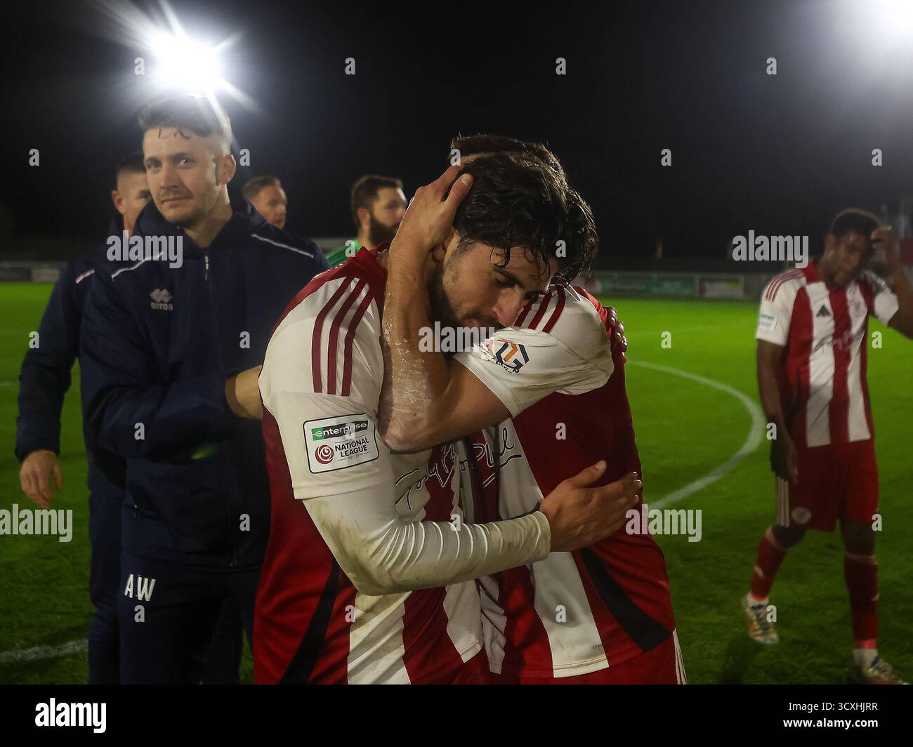 BRACKLEY, ENGLAND - OCTOBER 14: Jack Price embraces Scott Pollock of ...