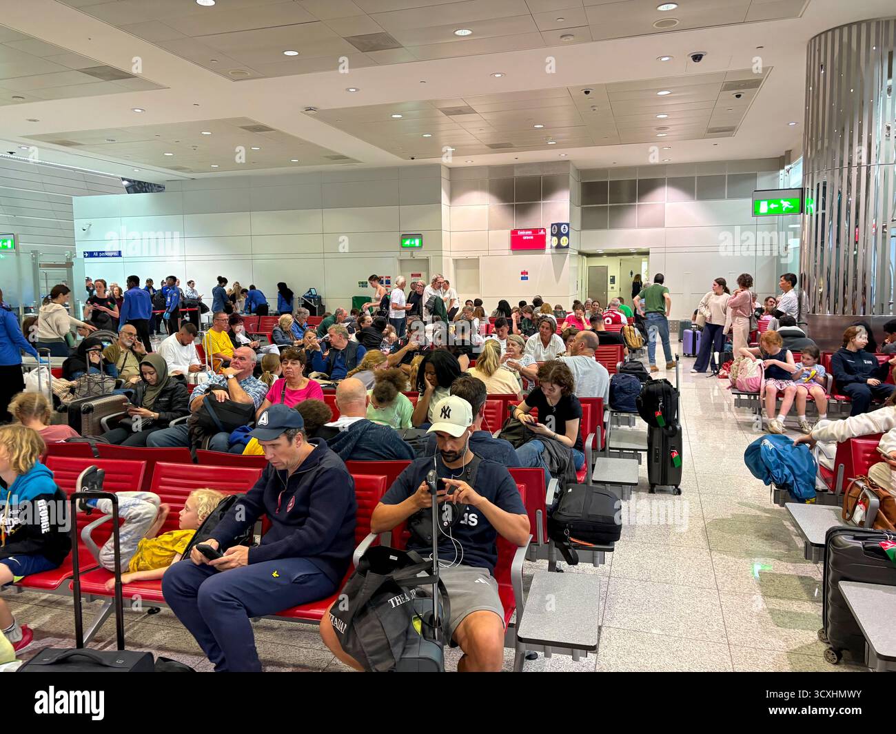 Dubai international airport, passengers at A23 departure gate in ...
