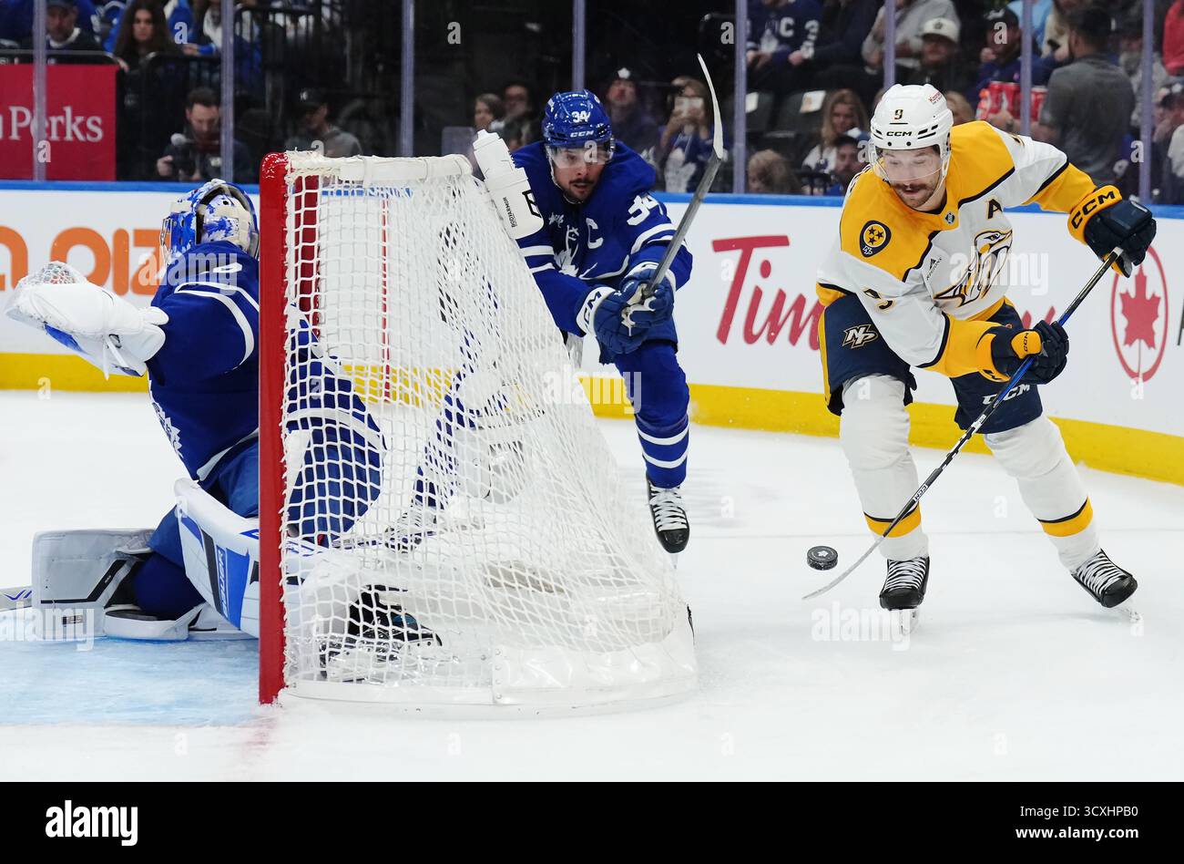 Nashville Predators' Filip Forsberg (9) protects the puck from Toronto ...