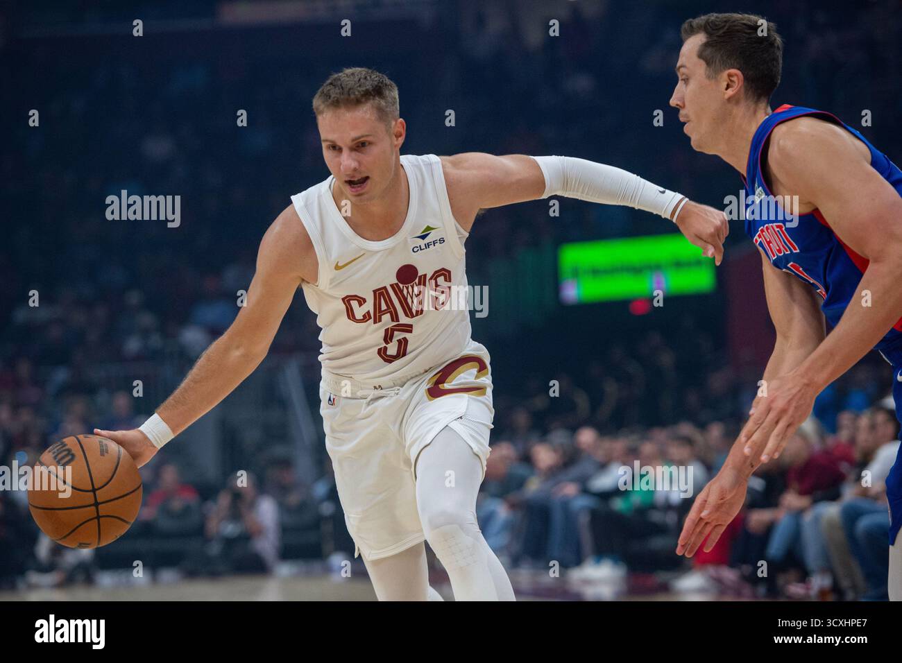 Cleveland Cavaliers' Sam Merrill (5) moves past Detroit Pistons' Duncan ...