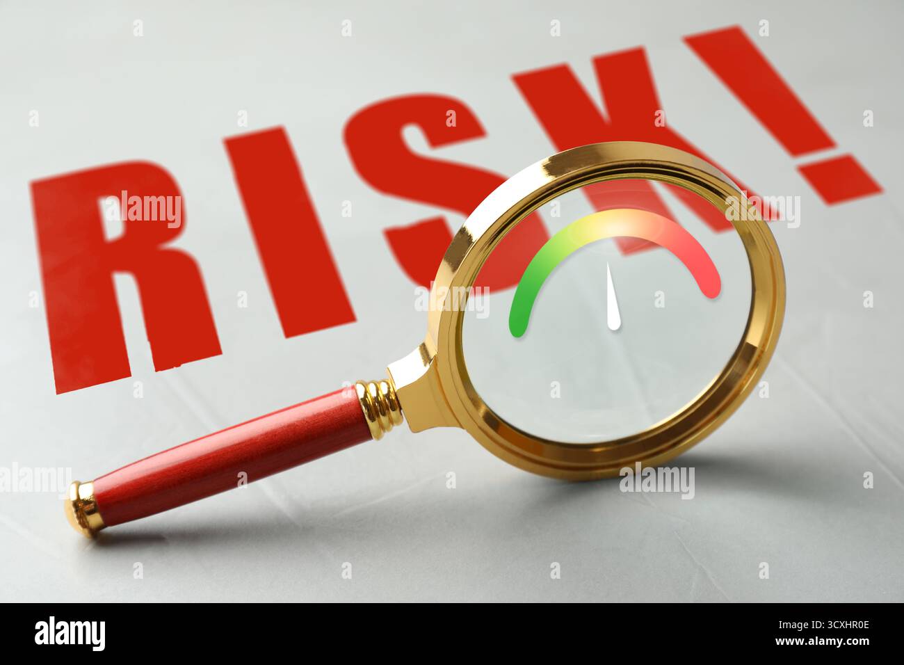 Risk. Magnifying glass with scale inside on light background Stock ...