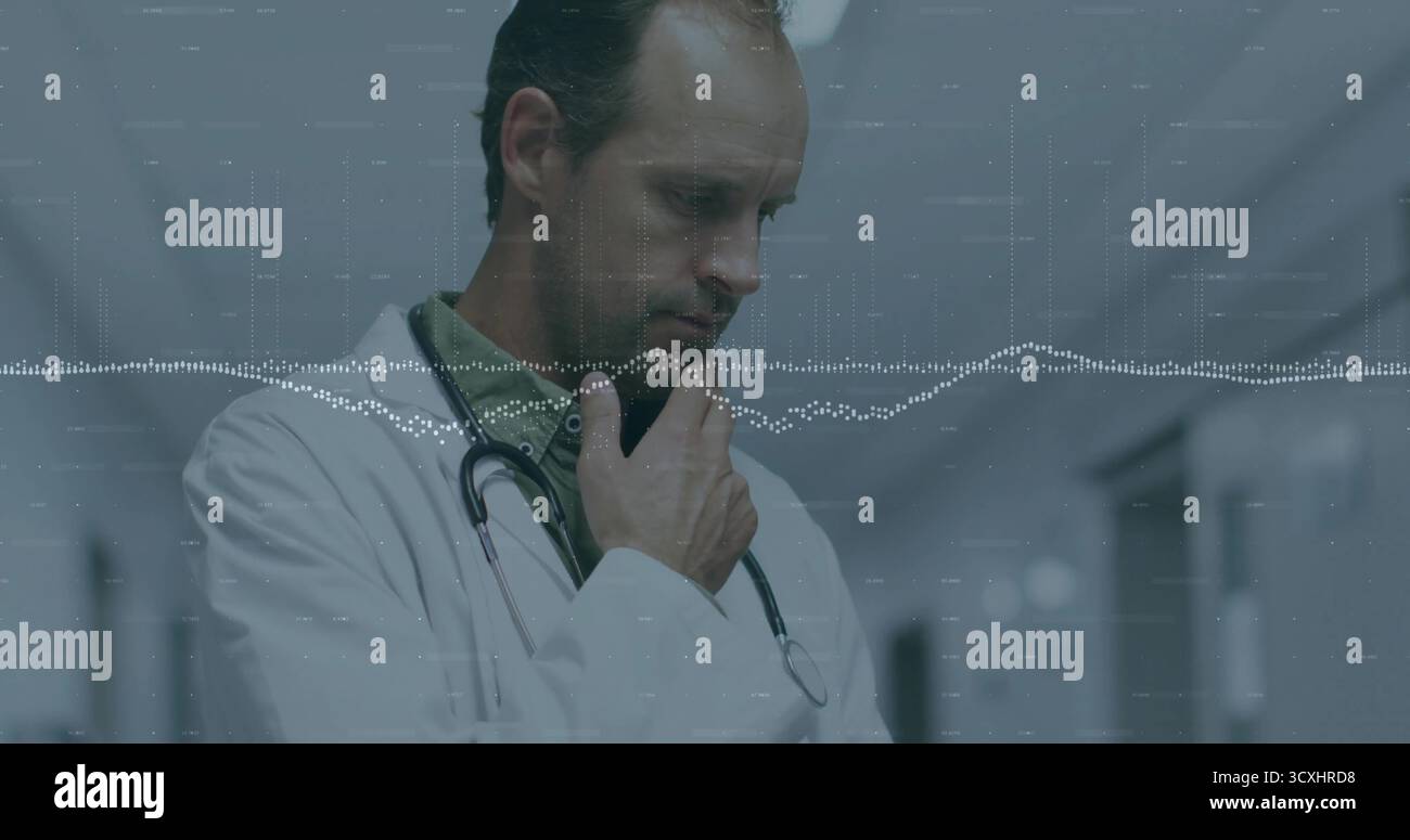 Standing mature doctor contemplating hi-res stock photography and ...