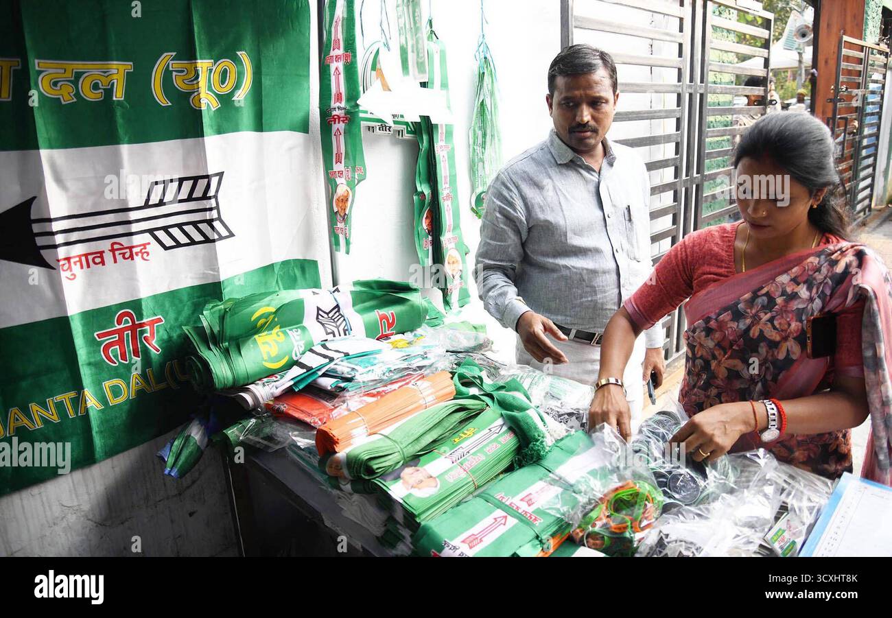 PATNA, INDIA - OCTOBER 14: JDU supporters buying party flags and other ...