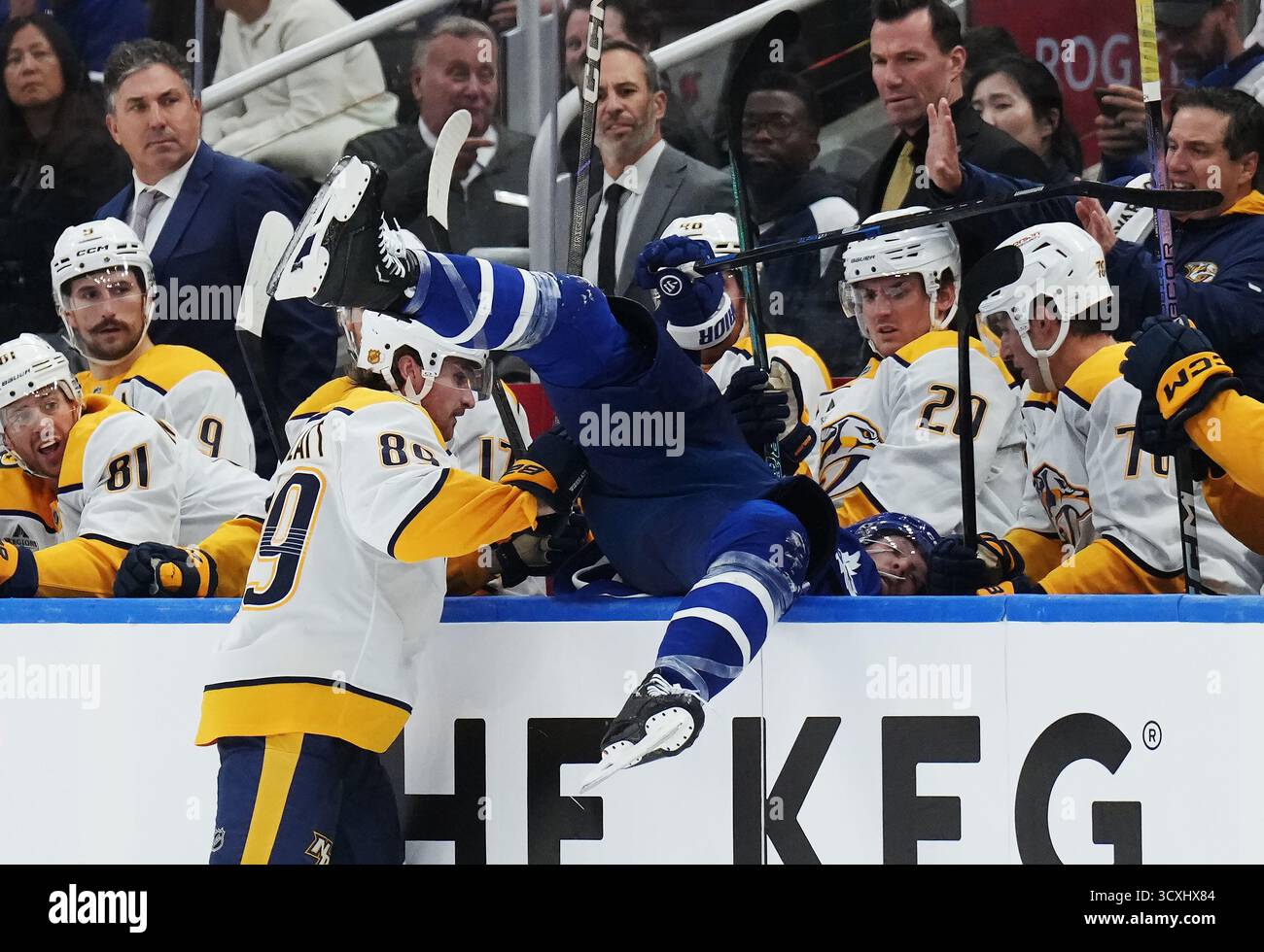 Nashville Predators' Ozzy Wiesblatt (89) hits Toronto Maple Leafs' Jake ...