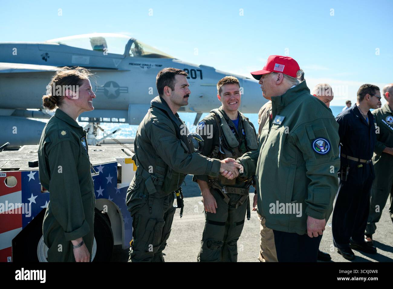 President Donald Trump and First Lady Melania Trump speak to sailors ...