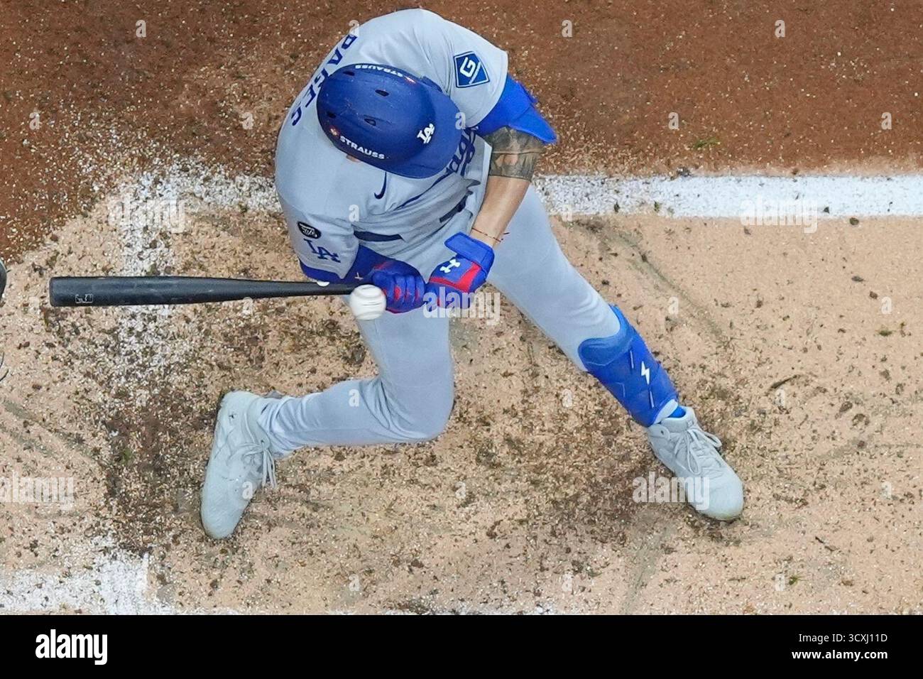 Los Angeles Dodgers' Andy Pages is hit by a pitch during the fifth ...